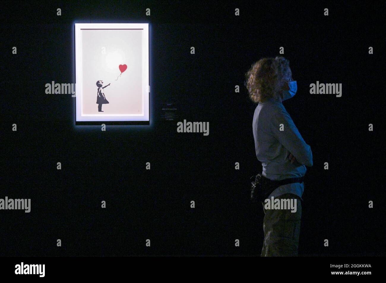 People view artworks by street artist Banksy at a press preview of the ...