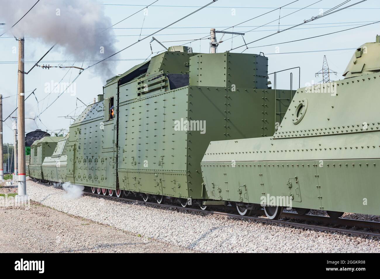 Armoured retro steam train moves Stock Photo - Alamy