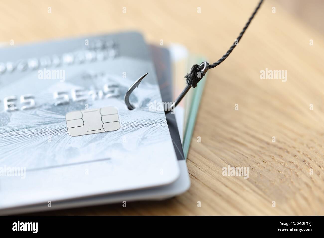 Phishing credit card scam using credit card in fishhook closeup Stock ...