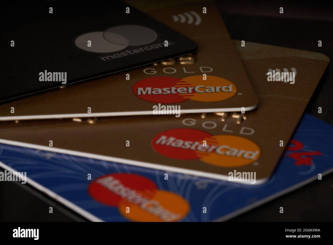 Stack of mastercard cards on black surface Stock Photo - Alamy