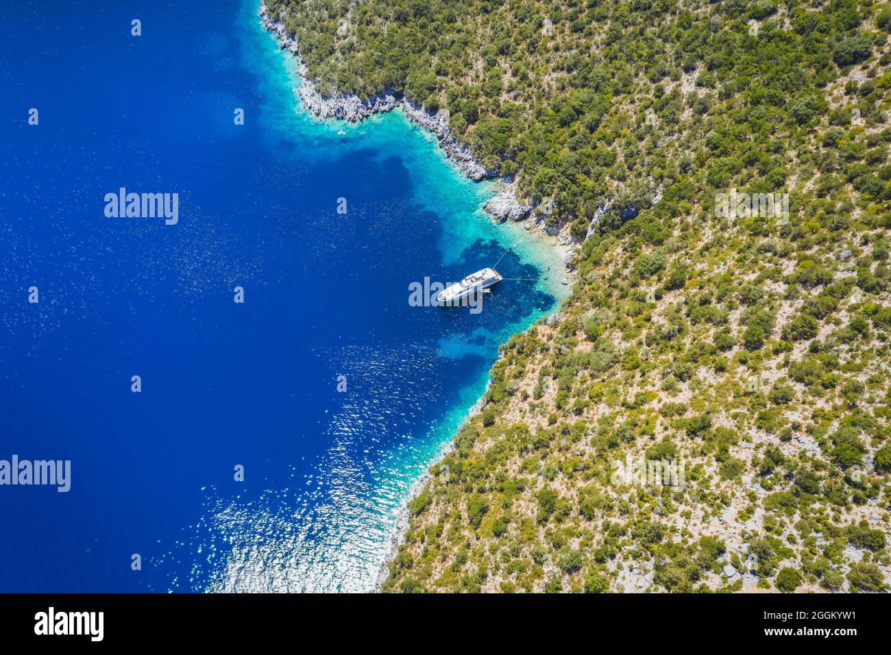 Aerial top down view to the beautiful and secluded Fteri beach on the ...