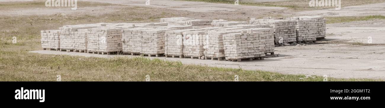 Outdoor storage of white brick blocks of building materials in a ...