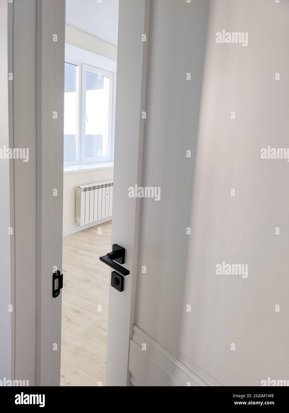 Door opened into the room - new house interior Stock Photo - Alamy