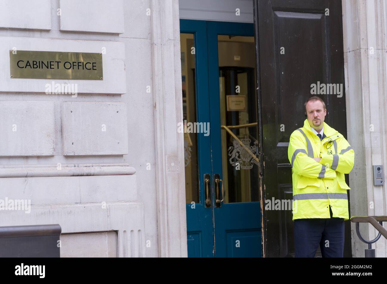 Security guard stand at the entrance to Cabinet office at 70 Whitehall ...