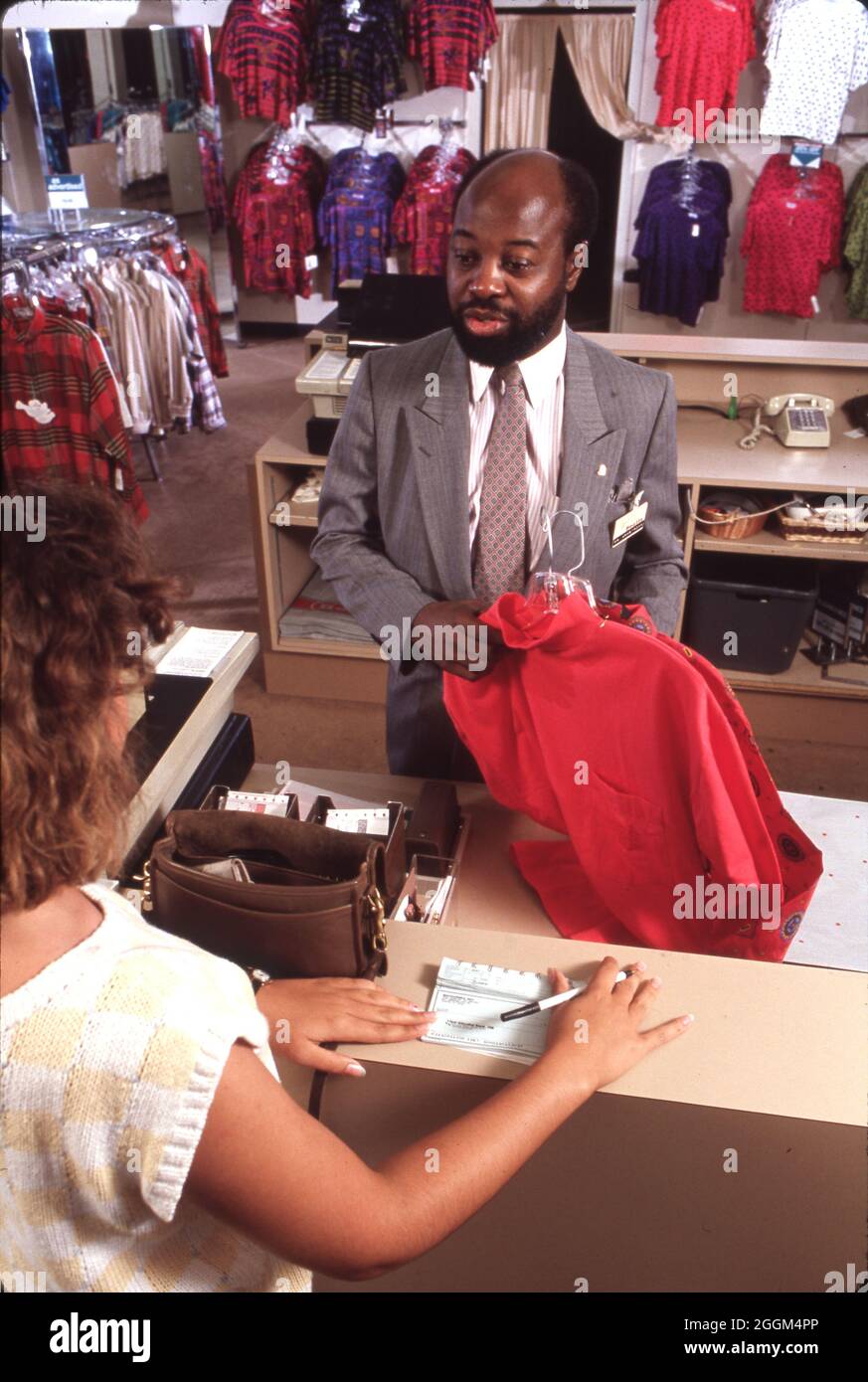 Shopper writing a check hi-res stock photography and images - Alamy