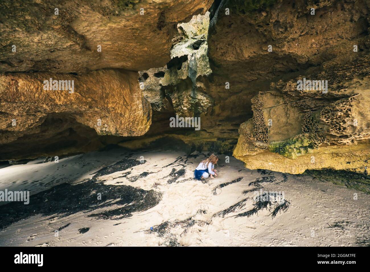 Girl climbing cave hi-res stock photography and images - Alamy