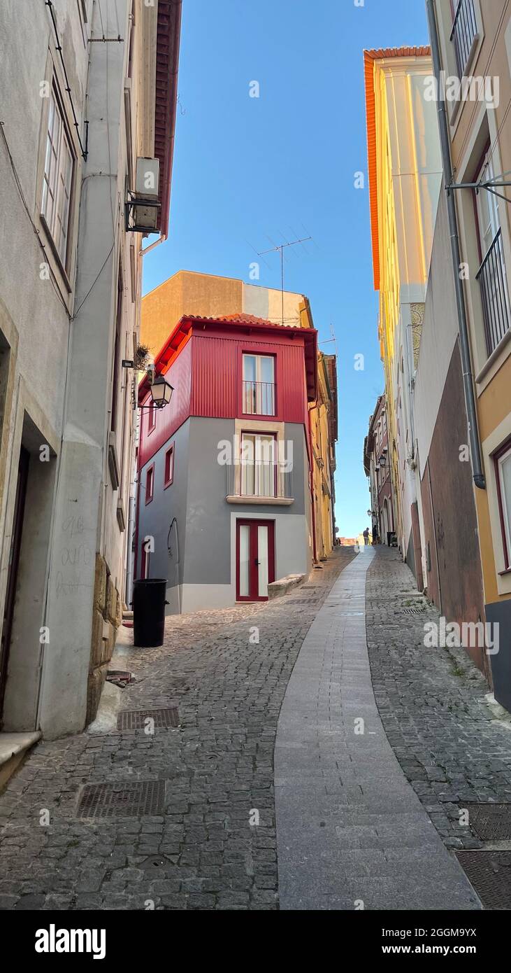 Uphill street with colorful building Stock Photo - Alamy