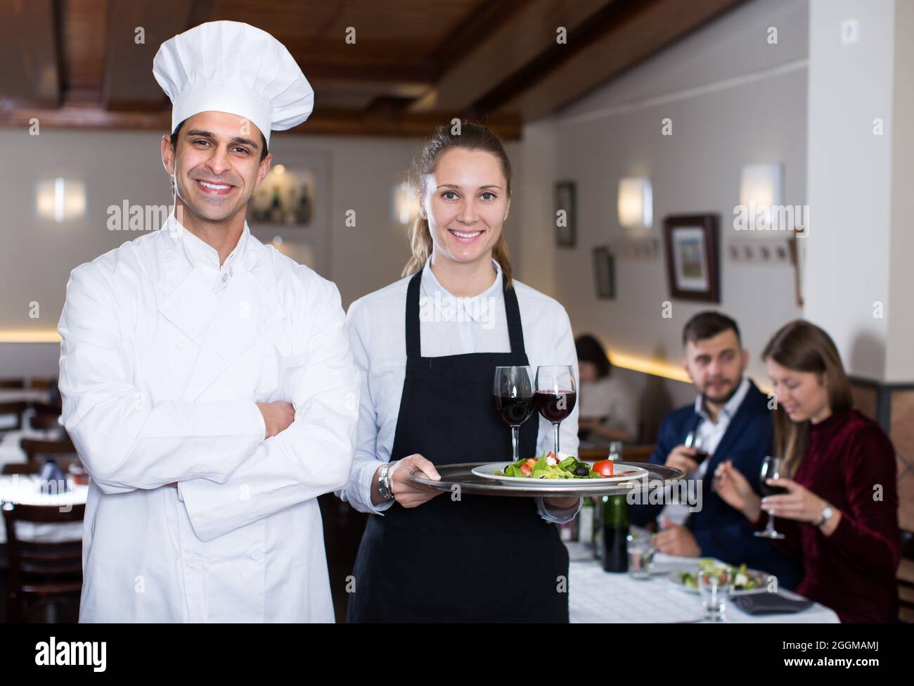 Portrait of confident man chef and smiling waitress Stock Photo - Alamy