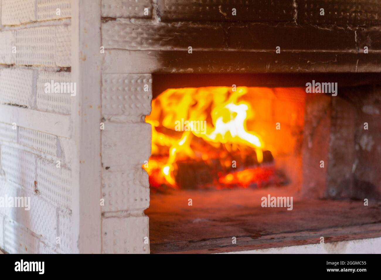 Russian stove.Fire in a Russian oven for cooking Stock Photo - Alamy