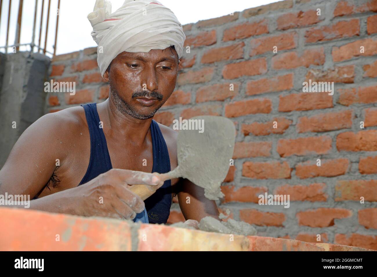 Manual Workers doing laborious job at a rural construction site in New ...
