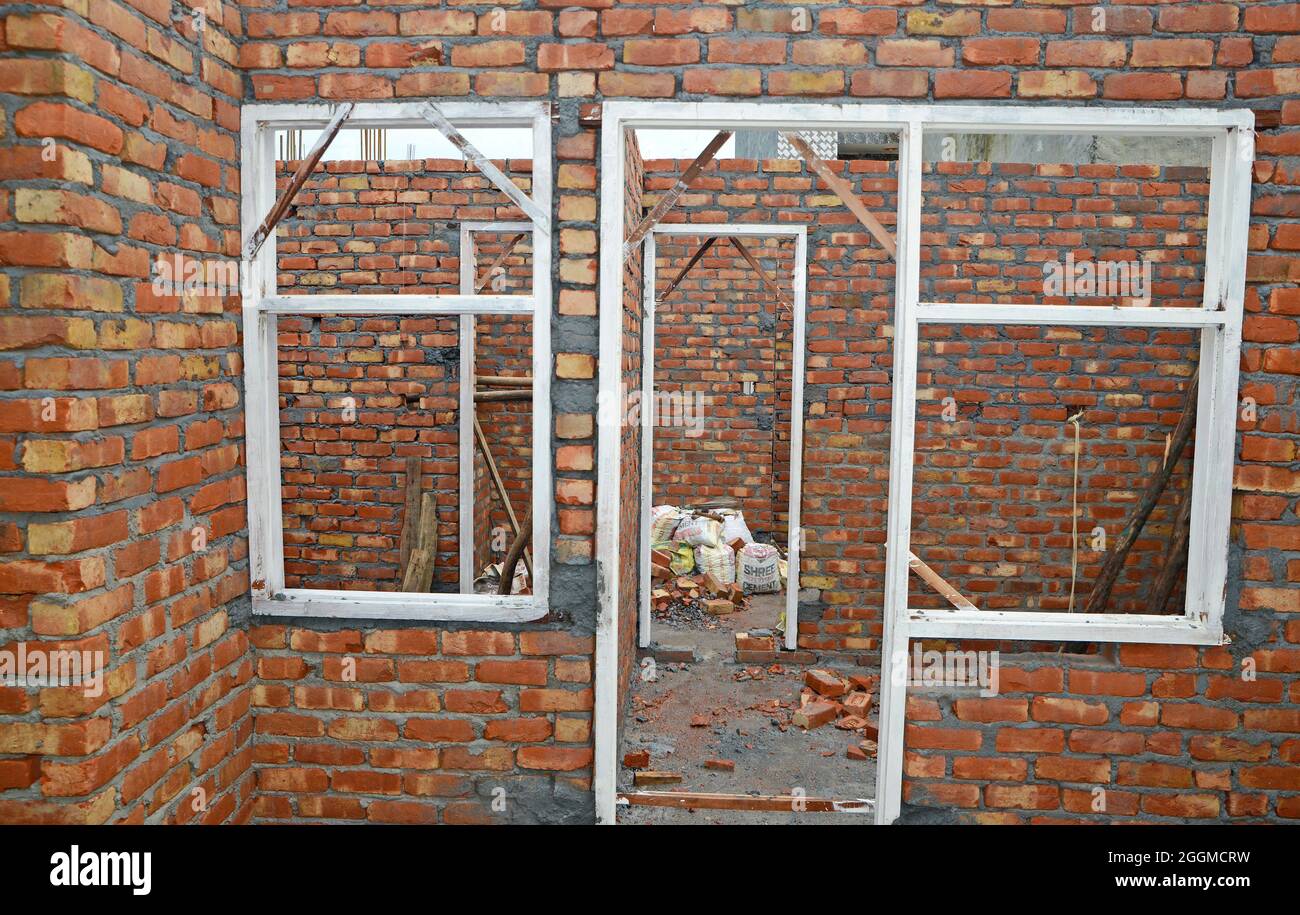 Red brick house under construction Stock Photo - Alamy