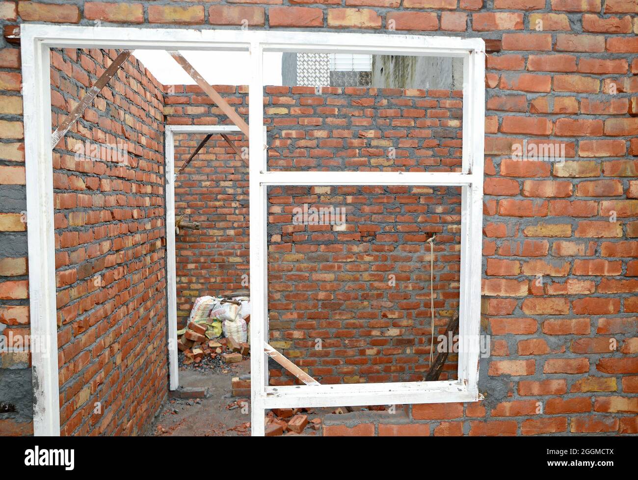 Red brick house under construction Stock Photo - Alamy