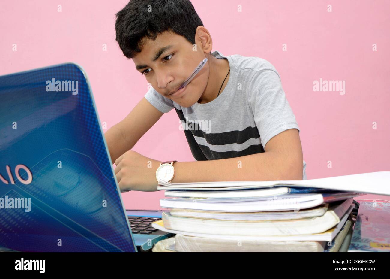 Boy Working on laptop Stock Photo - Alamy
