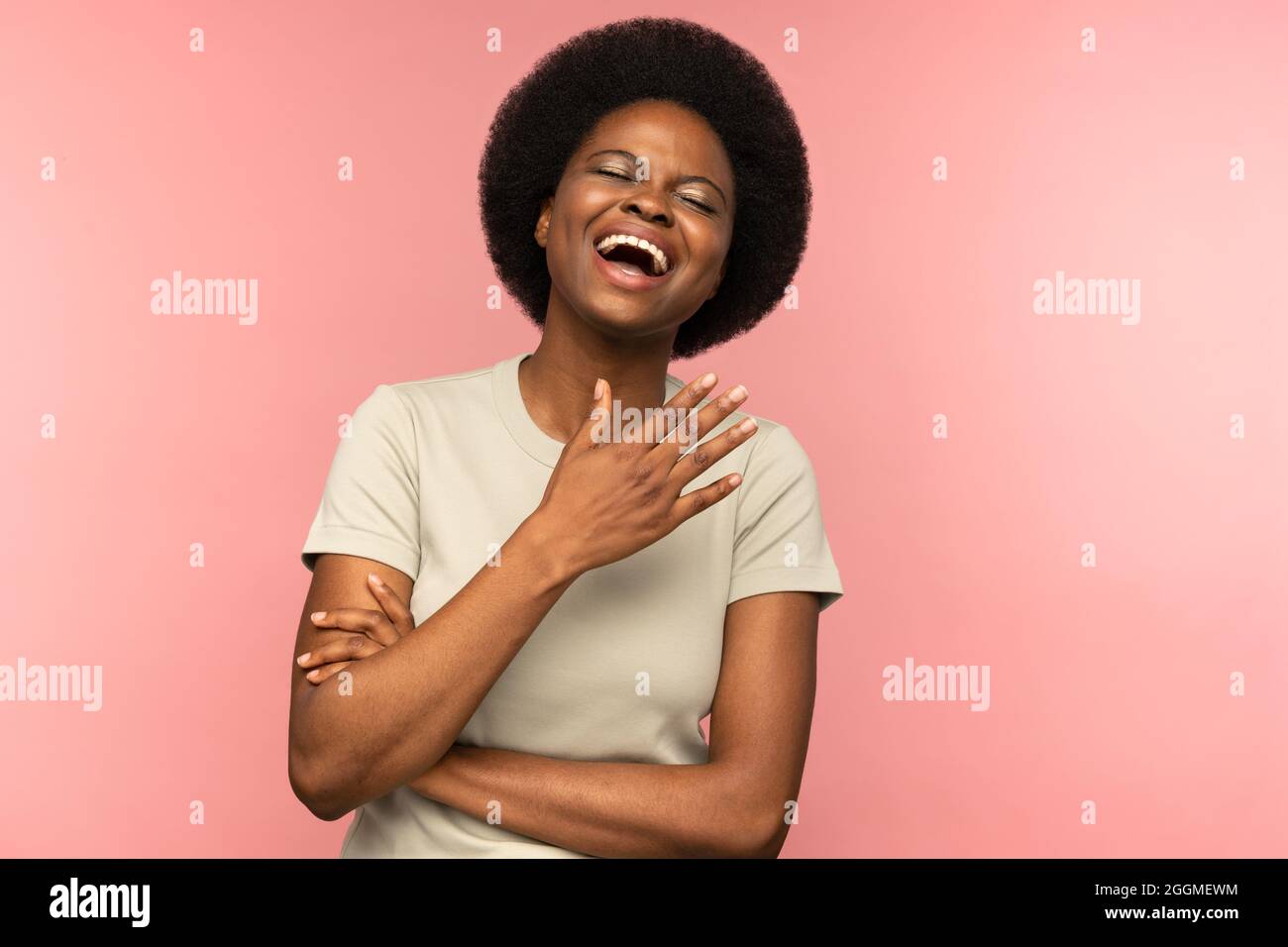 Cute African American female with afro hairstyle laughing from joke ...