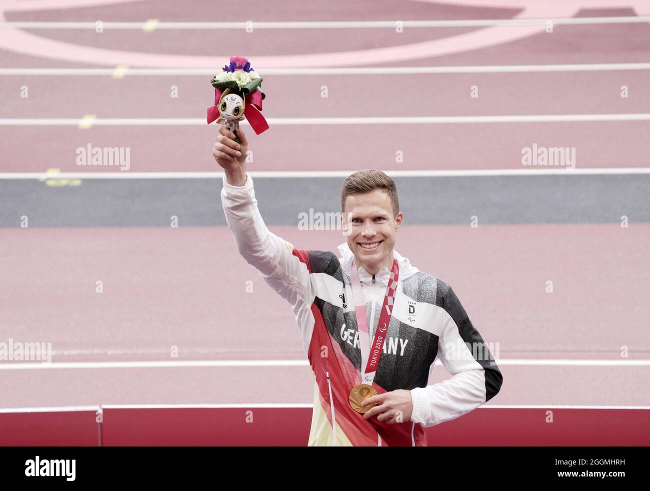 Markus Rehm of Germany poses with the gold medal for the men's T64 long ...