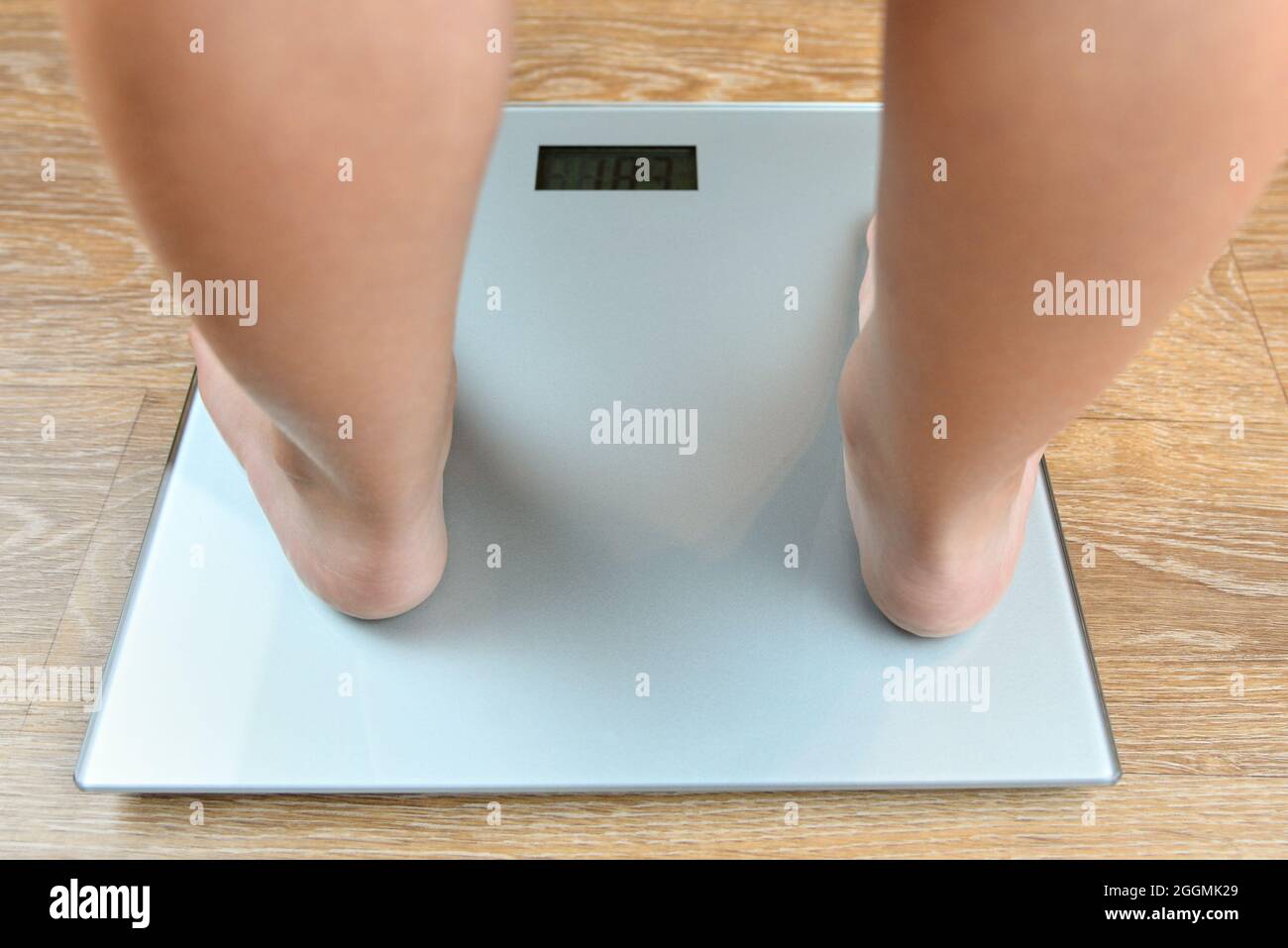 Fat child scales hi-res stock photography and images - Alamy