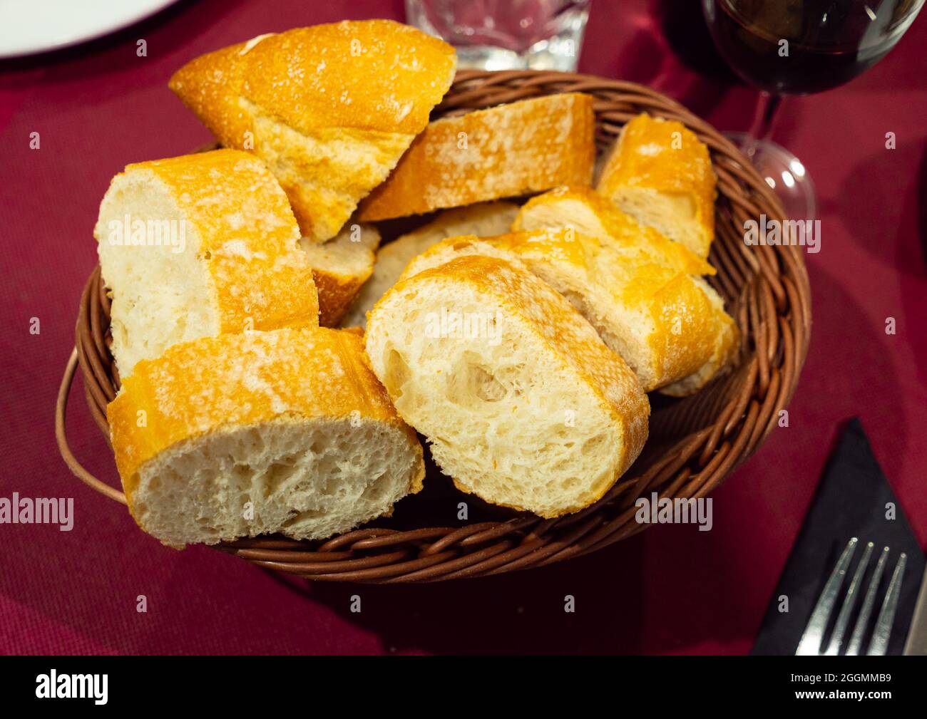 Bread served on table with glass of red wine Stock Photo - Alamy