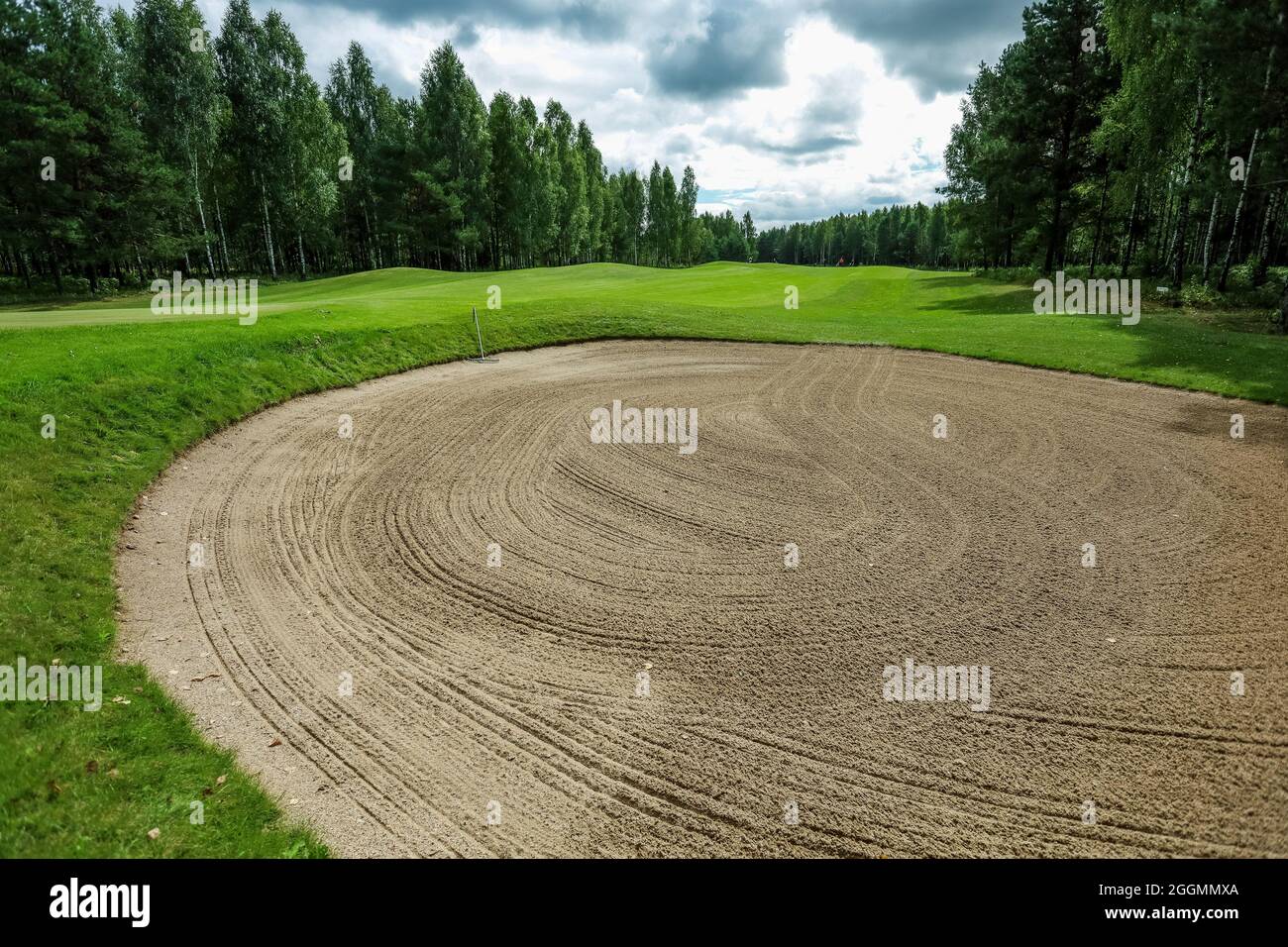 Beautiful golf course with a sand trap. High quality photo Stock Photo ...