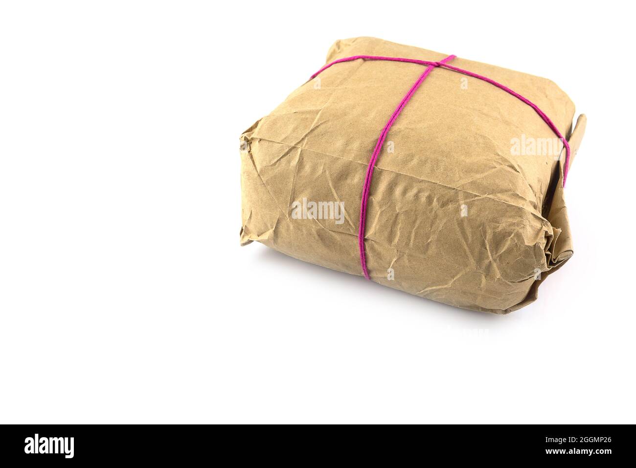 Parcel wrapped with brown paper, tied with pink string isolated on ...