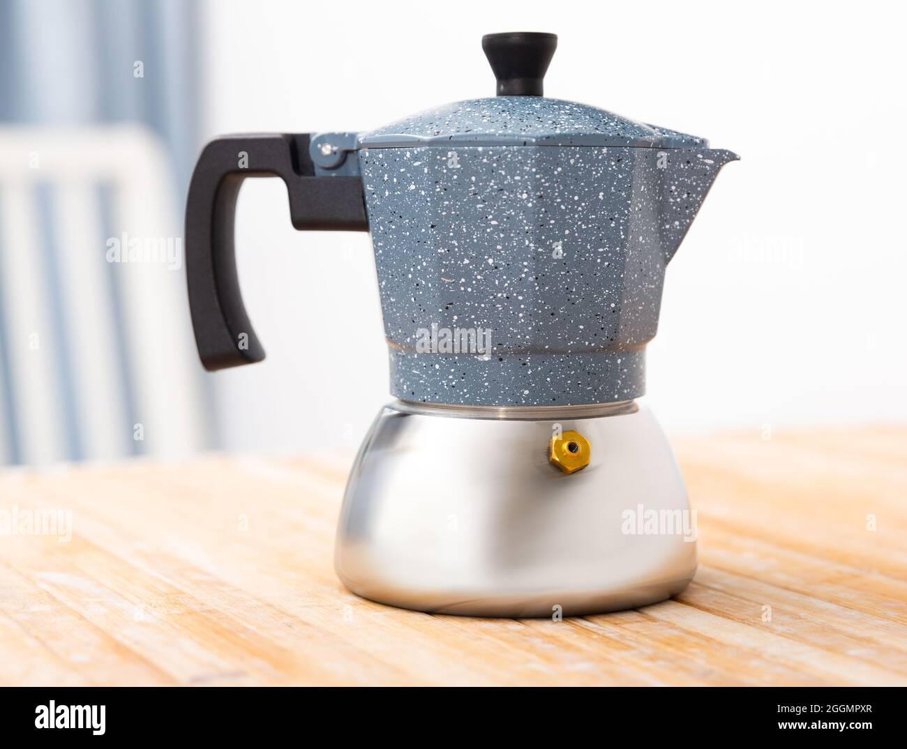 Coffee pot on table in kitchen Stock Photo - Alamy