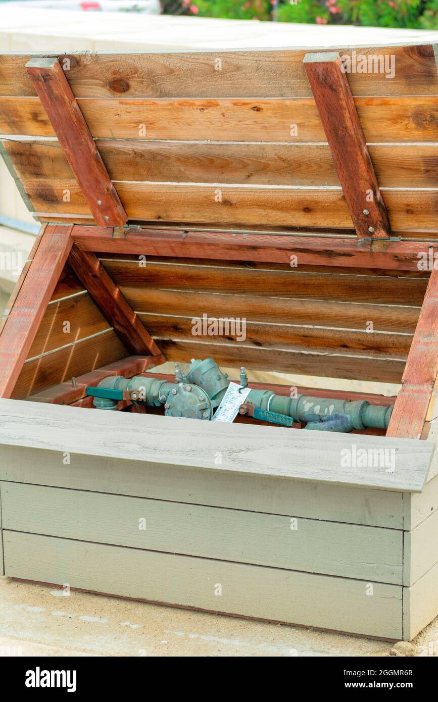 Vertical shot of an open wooden water pipe box Stock Photo - Alamy