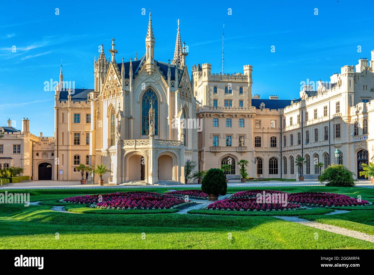 Lednice Chateau with beautiful gardens with flowers and parks on sunny ...