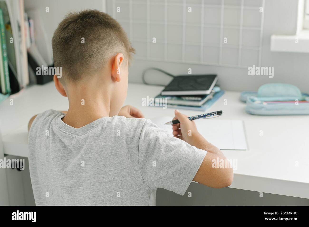 Asian boy doing math homework hi-res stock photography and images - Alamy
