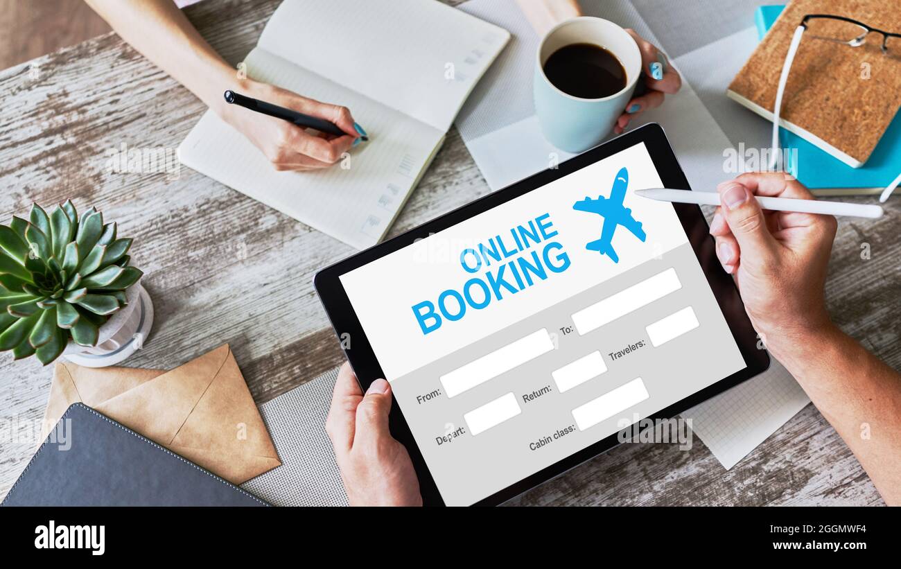 Online flight booking service form on device screen Stock Photo - Alamy