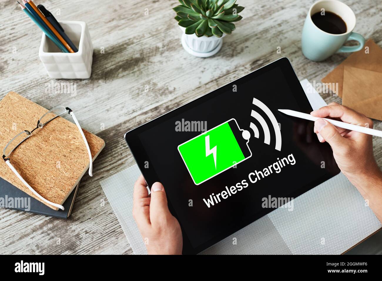 Wireless charging icons and progress bar on device screen Stock Photo ...