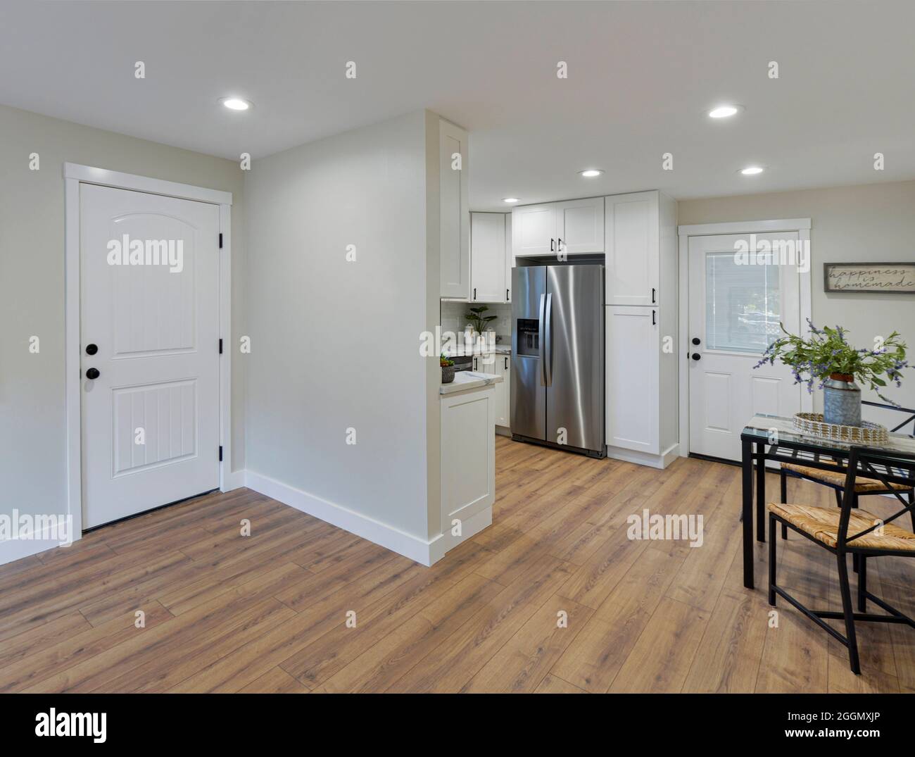 Modern residential front entrance, dining room, and kitchen interior ...