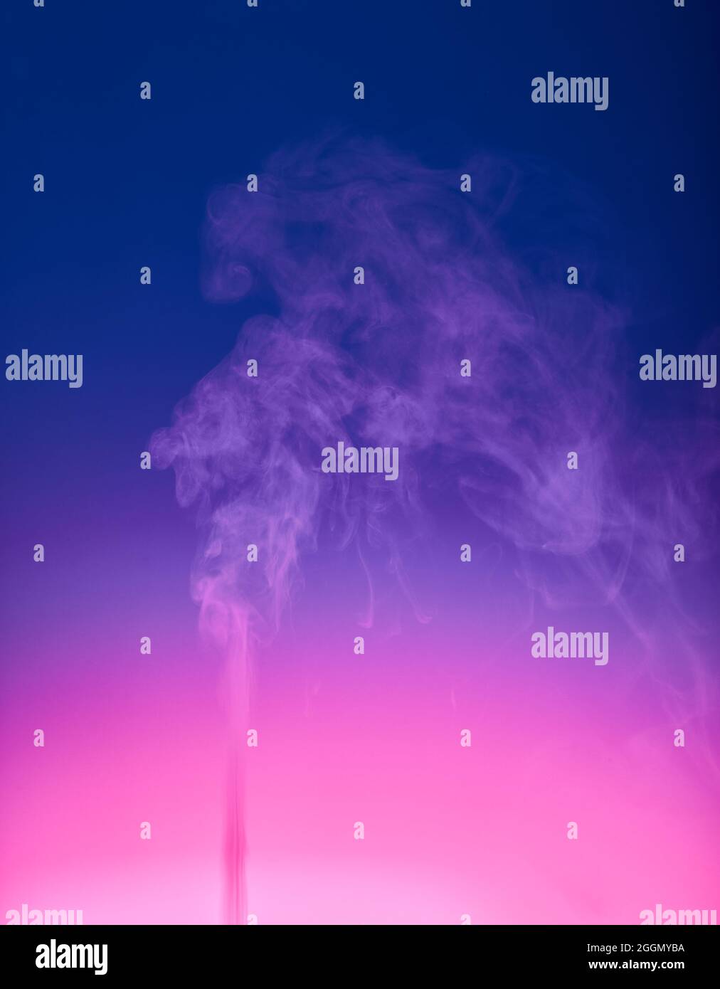 Smoke rising from diffuser with red blue purple neon gradient light ...