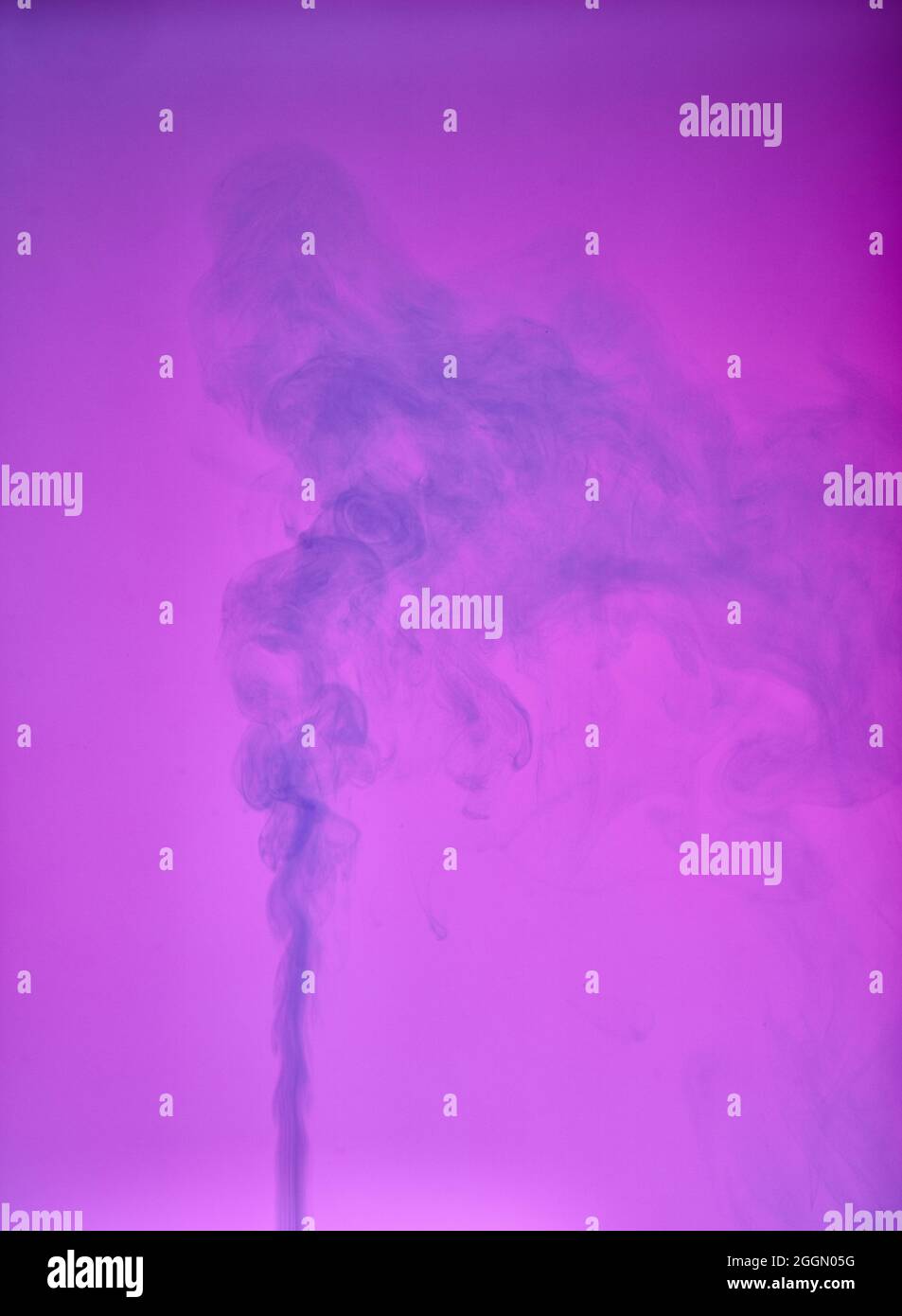 Smoke rising from diffuser with red blue purple neon gradient light ...