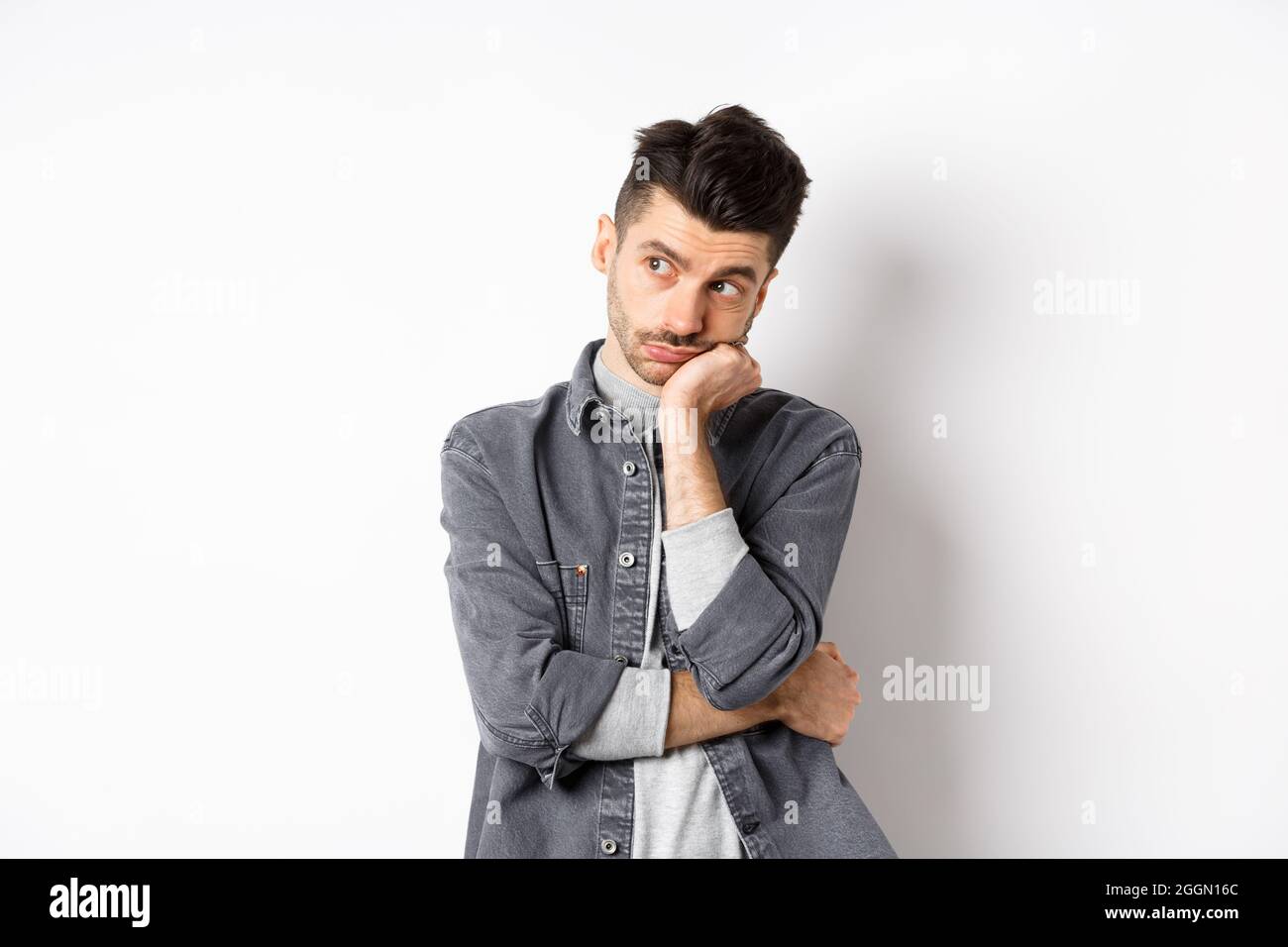 Gloomy thoughtful man looking aside, thinking or space out, staring at ...