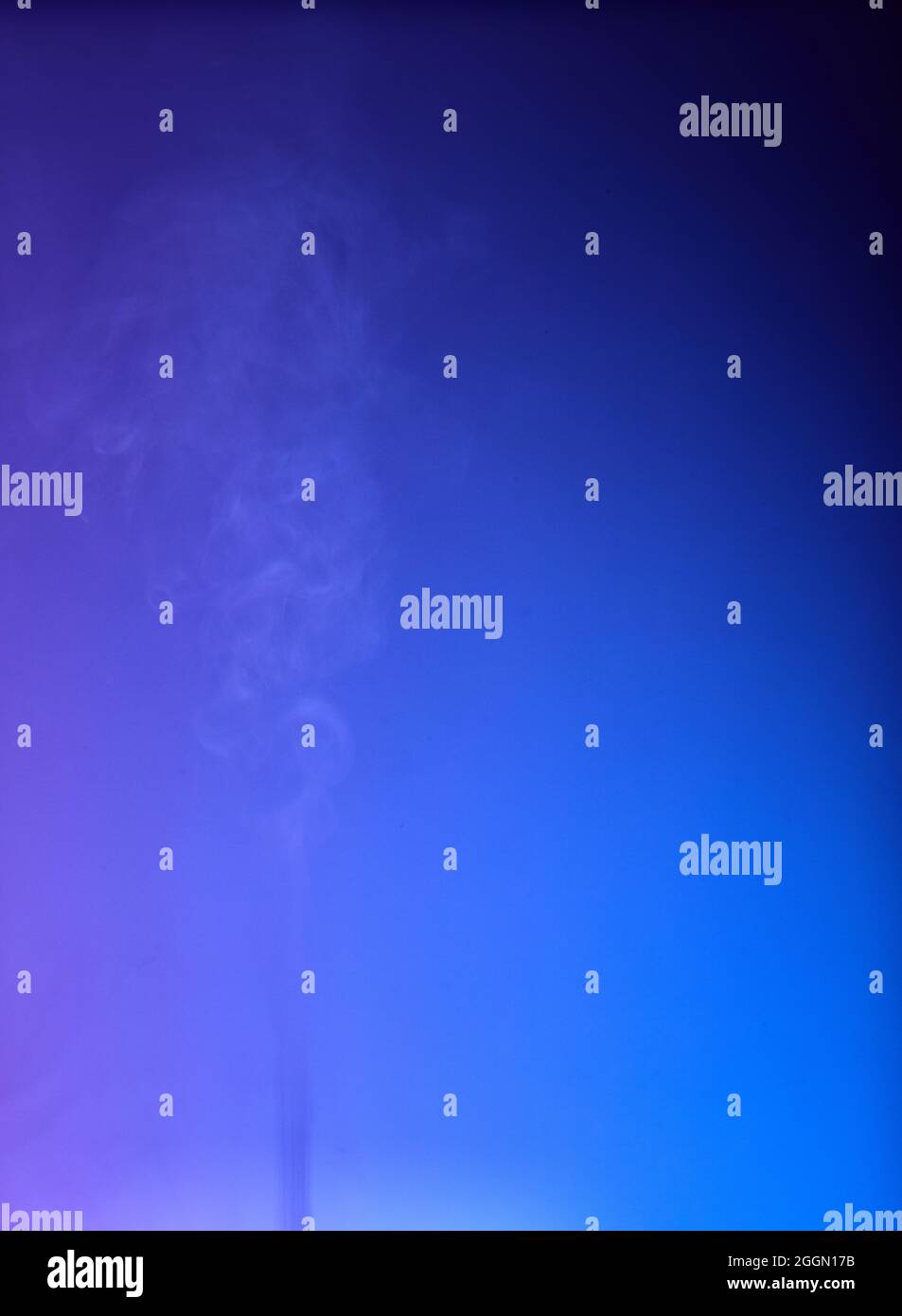 Smoke rising from diffuser with red blue purple neon gradient light ...