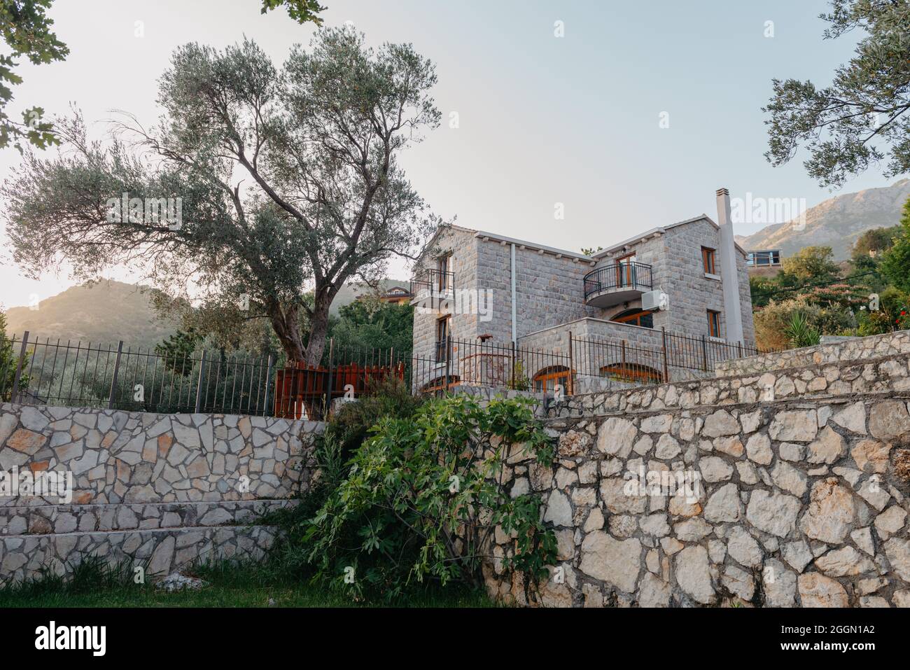 Huge luxury old style house at sunset. Residential structure of a ...