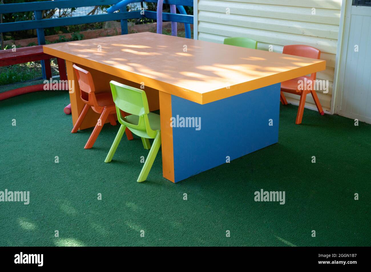 Children's table with and chairs in the playground Stock Photo - Alamy