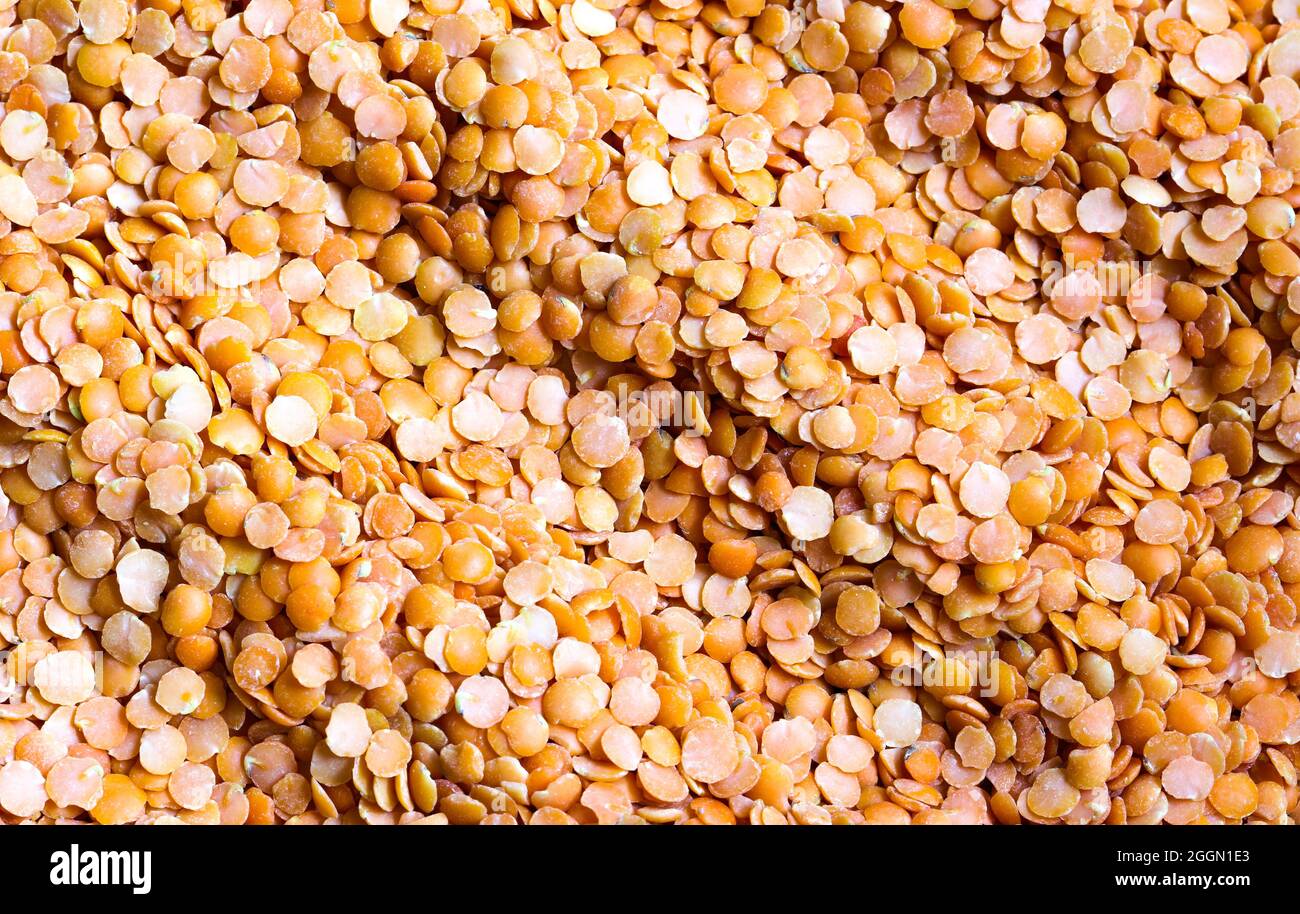 Yellow lentils, detail texture background, closeup of lentils ...
