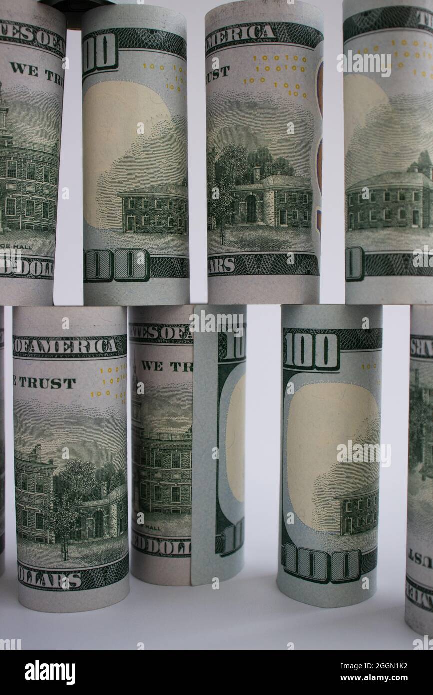 The wall from 100 dollars banknotes. Money construction Stock Photo - Alamy