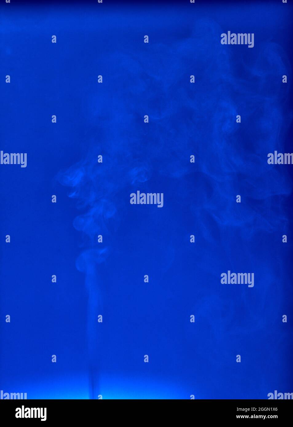 Smoke rising from diffuser with red blue purple neon gradient light ...