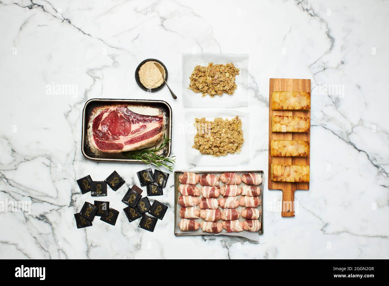 Various cuts of meat on a marble background Stock Photo - Alamy