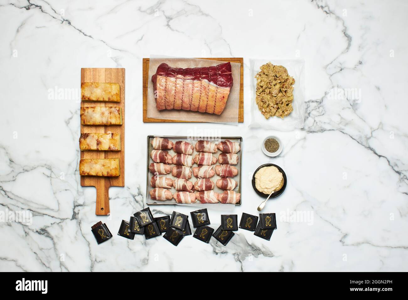 Various cuts of meat on a marble background Stock Photo - Alamy