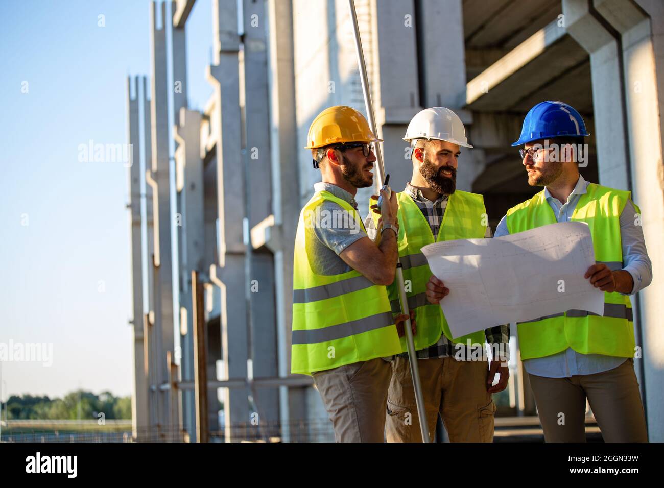 Construction engineers discussion with architects at construction or ...
