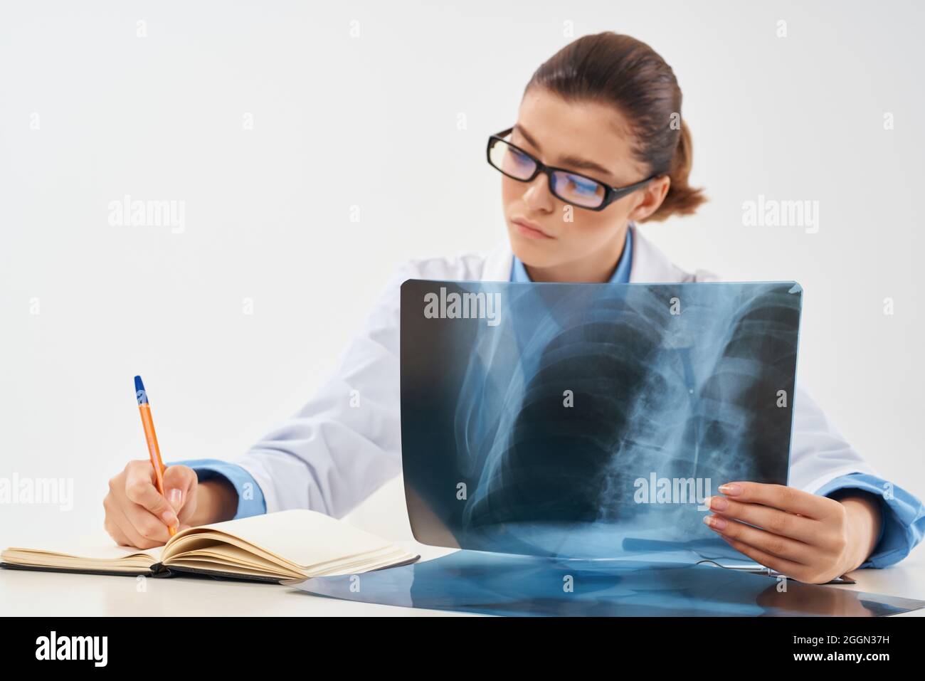 radiologist sitting at the table x-ray diagnostics treatment Stock ...
