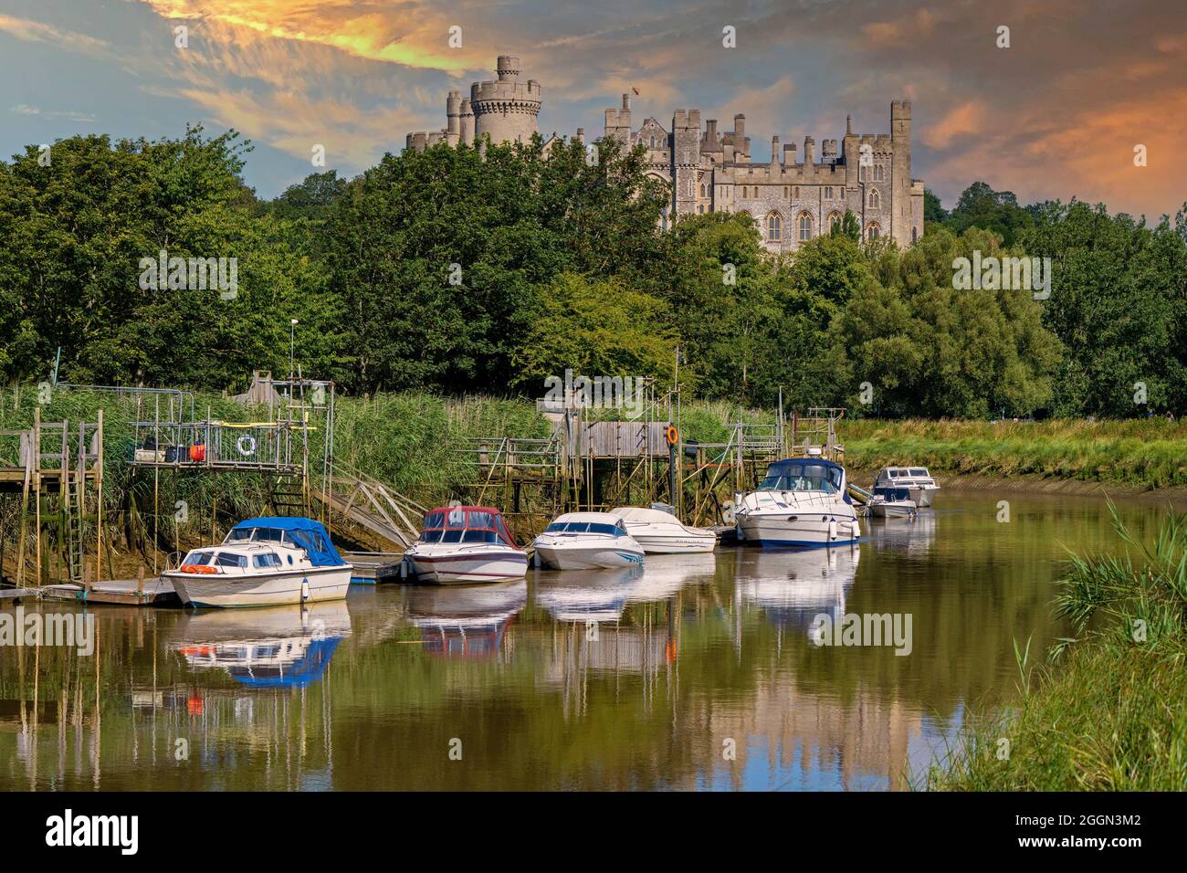 Arundel Castle and boats on the River Arun during sunset, Arundel, West ...