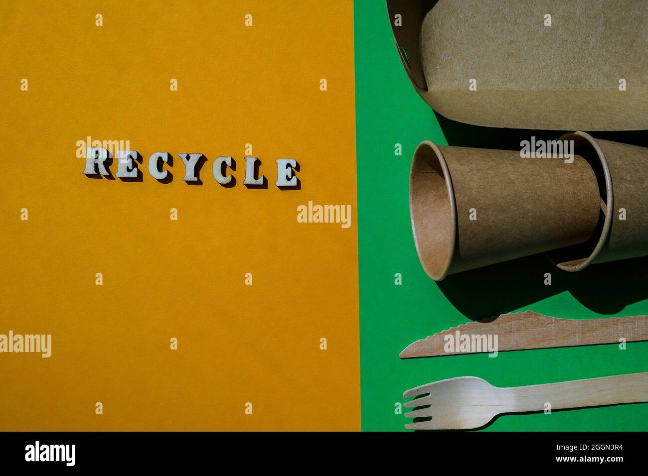RECYCLE text Wooden forks and paper cups with plates on color ...