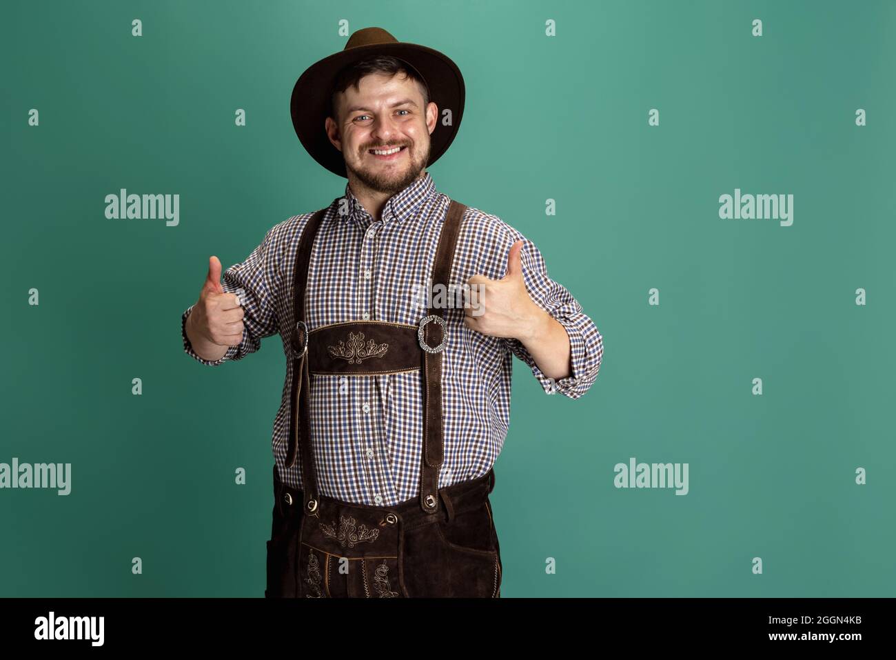 Portrait of bearded smiling man in traditional Bavarian costume ...