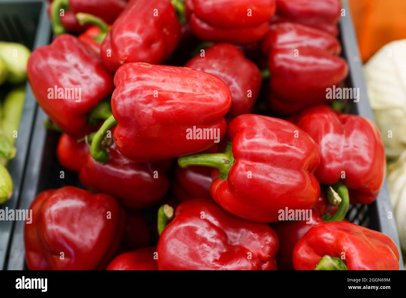 Fresh red sweet bell peppers on the market Stock Photo - Alamy