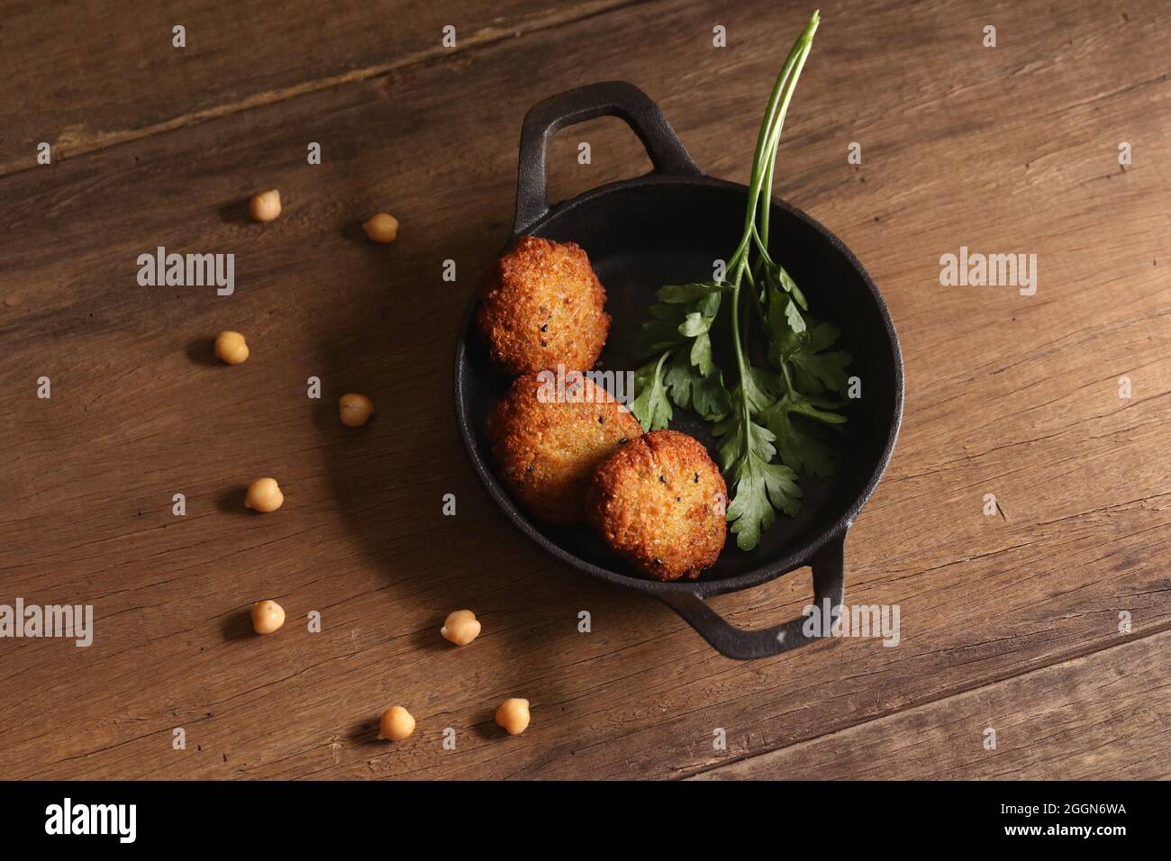 Falafel balls on iron skillet Stock Photo - Alamy