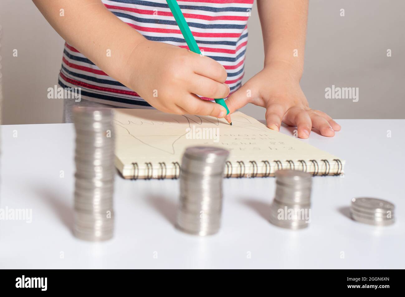 A preschooler's child records and calculates financial expenses ...