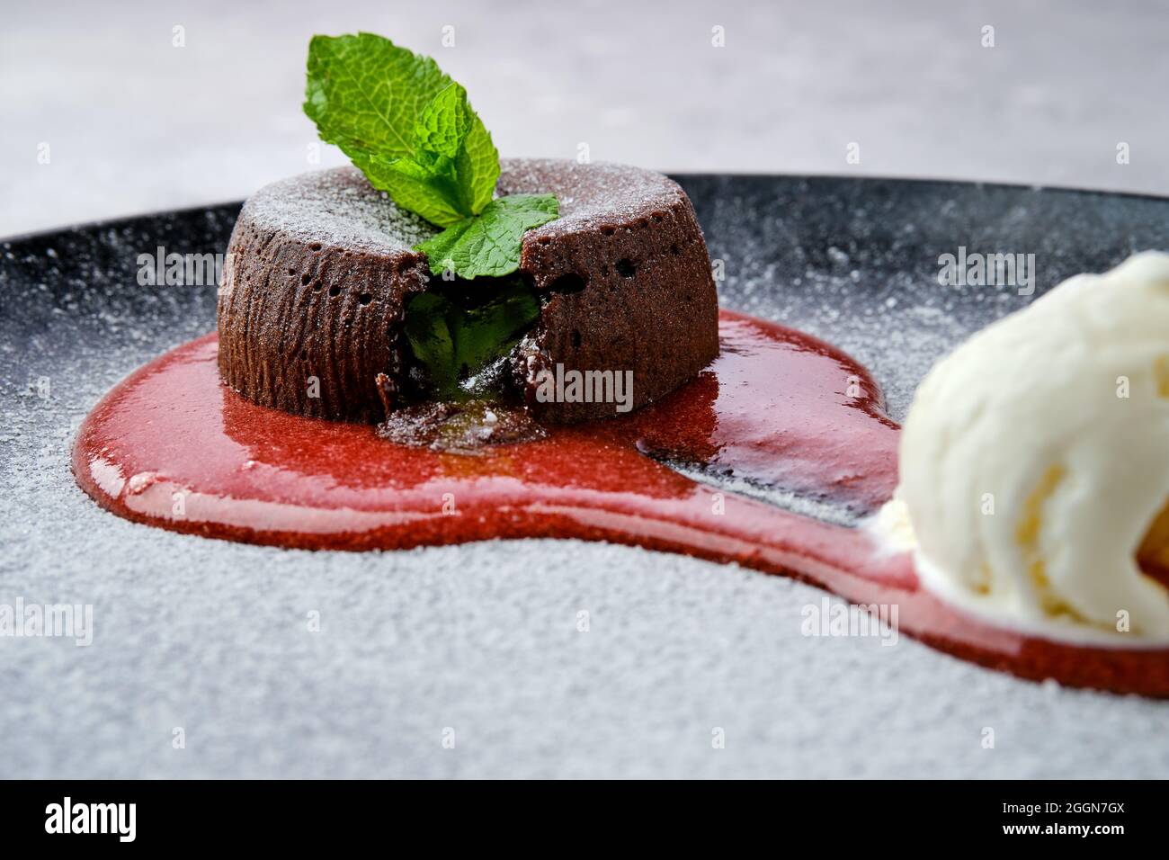 Closeup view of classic chocolate fondant with ice cream on a plate ...